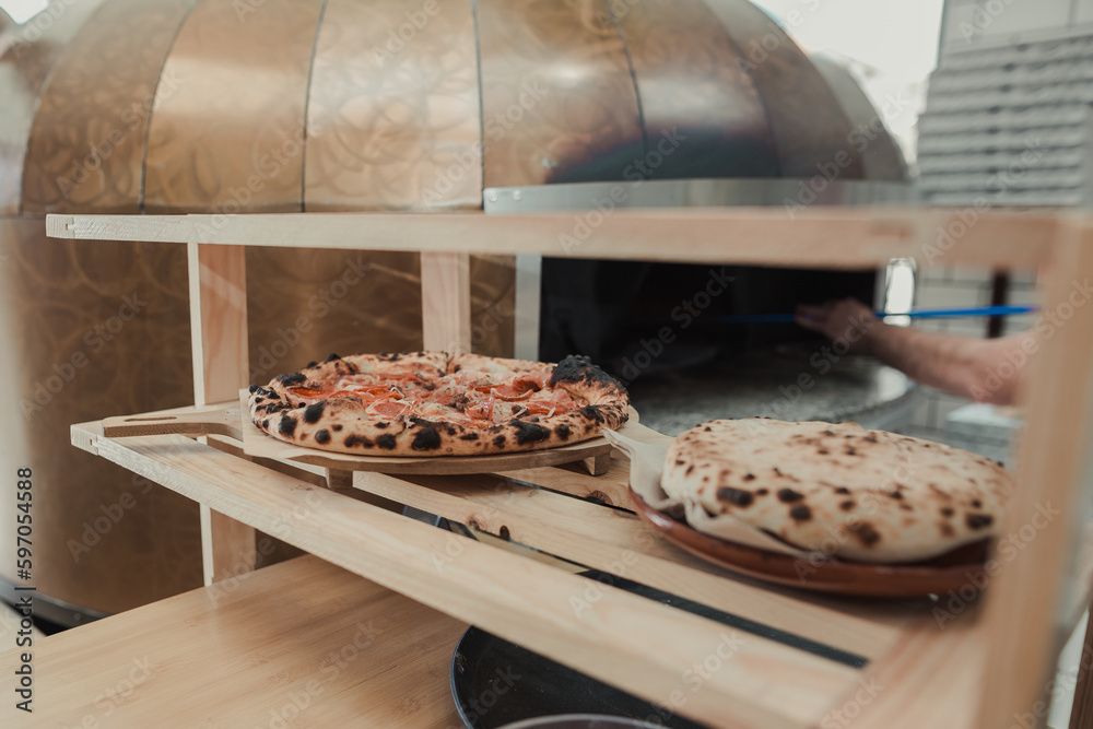 Pair of pizzas ready to serve in a restaurant Stock Photo | Adobe Stock
