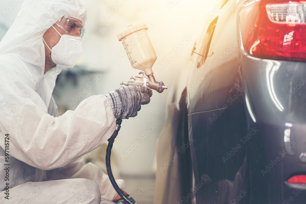 Automotive paint services, quality auto body shop concept. Male car ...