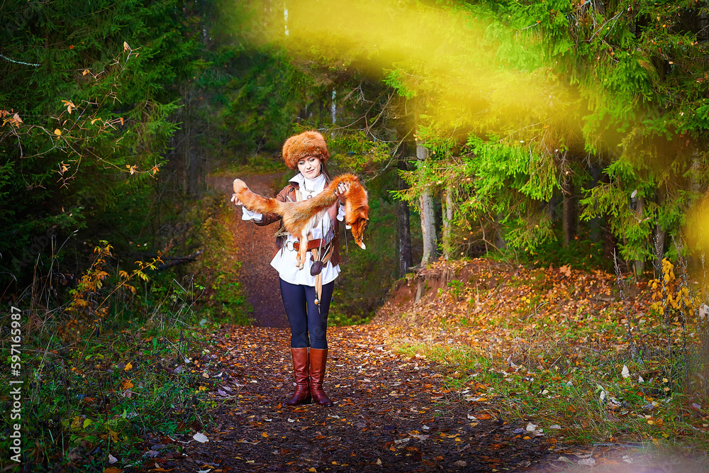 Girl in a leather jacket, a big red fox fur hat and with the skin of a ...