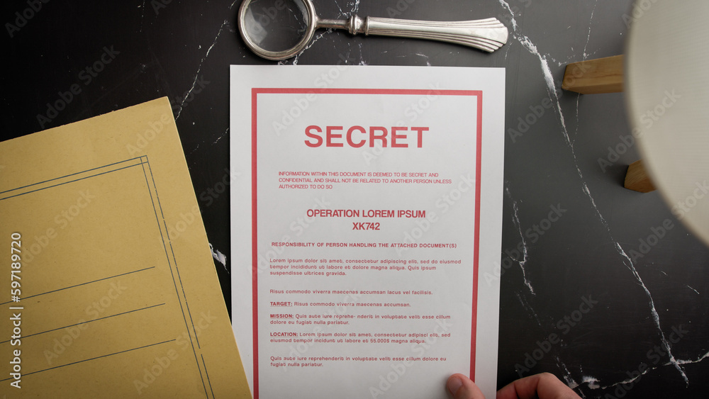 Foto de Inspecting a top secret sheet with a magnifying glass do Stock ...