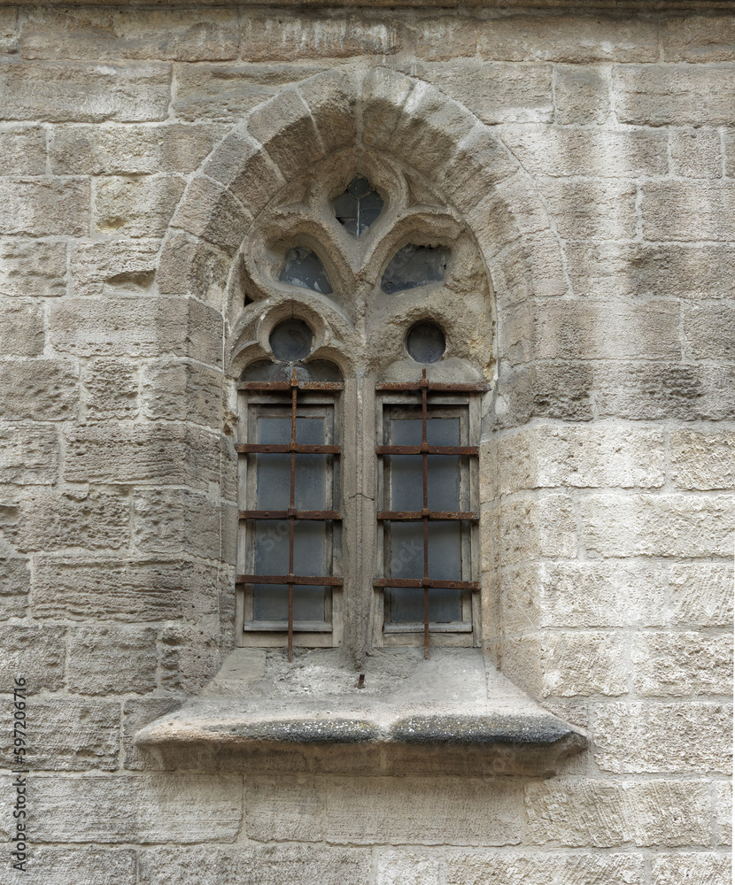 Mullioned window of a medieval church showing aged and stained ...