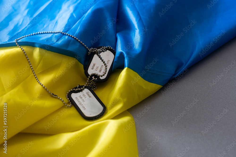 Army identification badges, ribbons of the Ukrainian flag, scattered ...