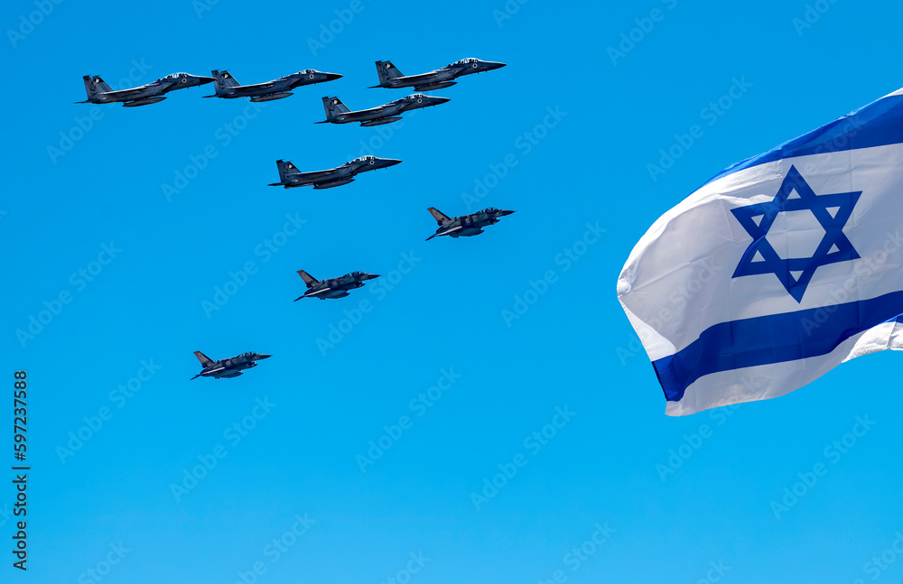 Waving Israeli Flag and Military Aircraft Show that takes part in air ...