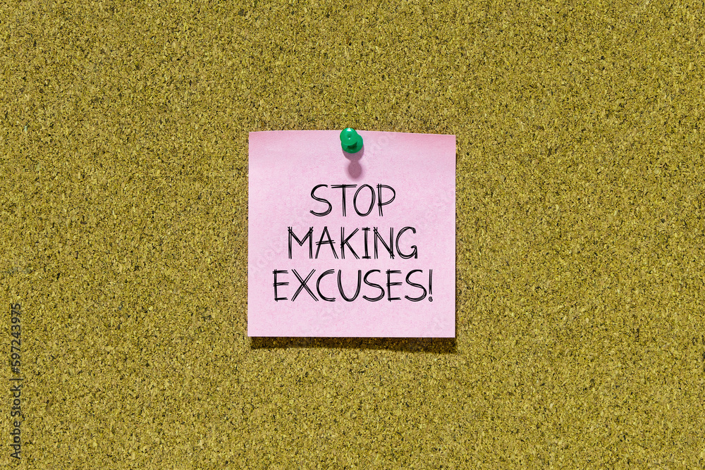 Stop making excuses text on pink post-it paper pinned on bulletin cork ...