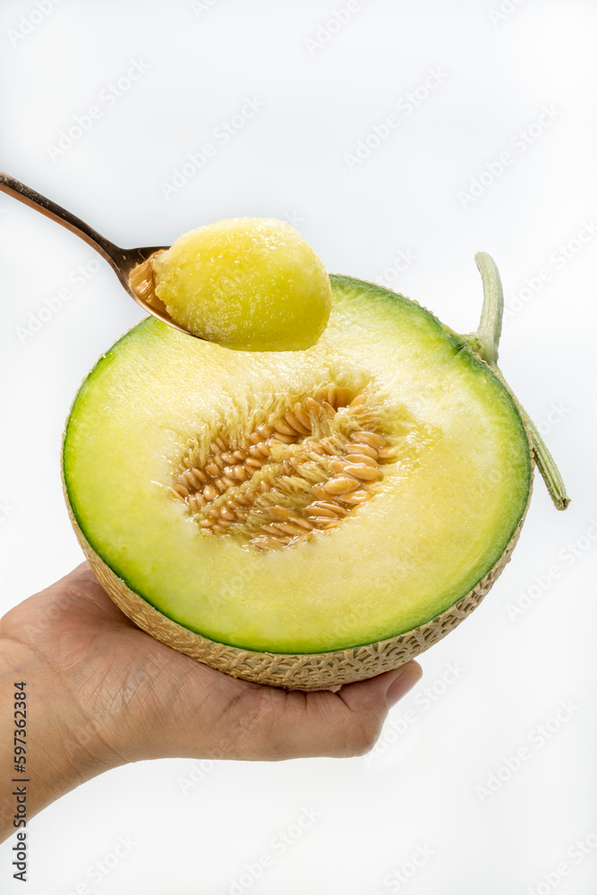 Golden spoon with Crown Musk Melon on white background, Shizuoka Crown ...