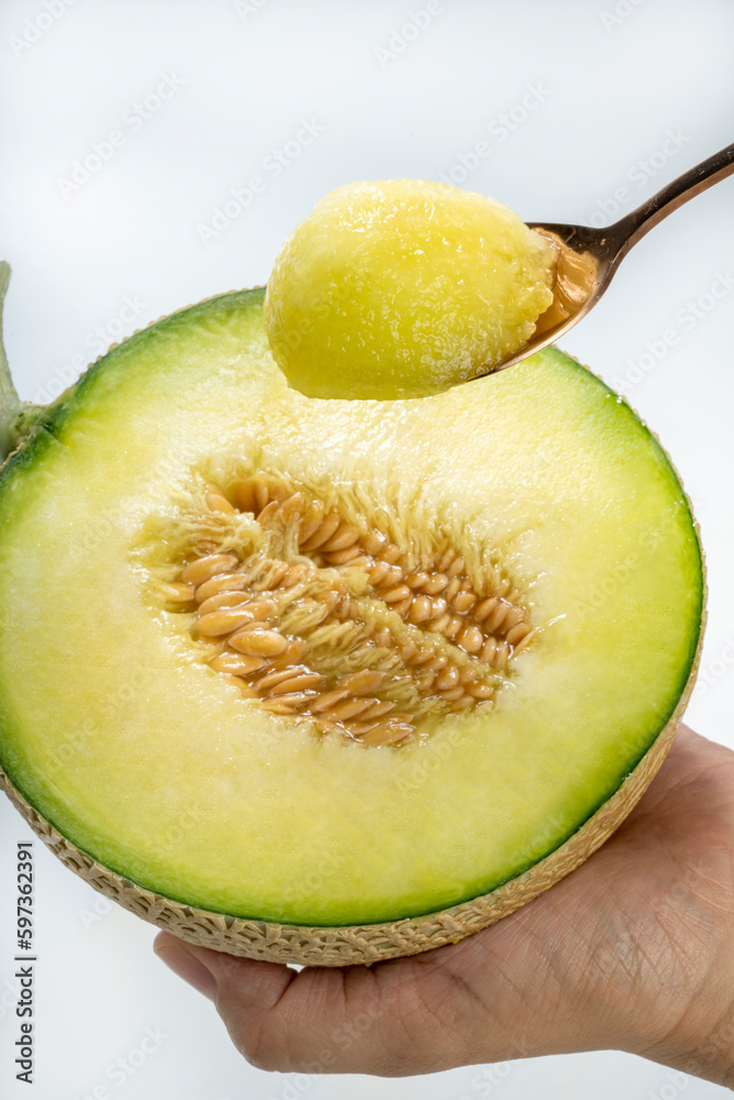 Golden spoon with Crown Musk Melon on white background, Shizuoka Crown ...