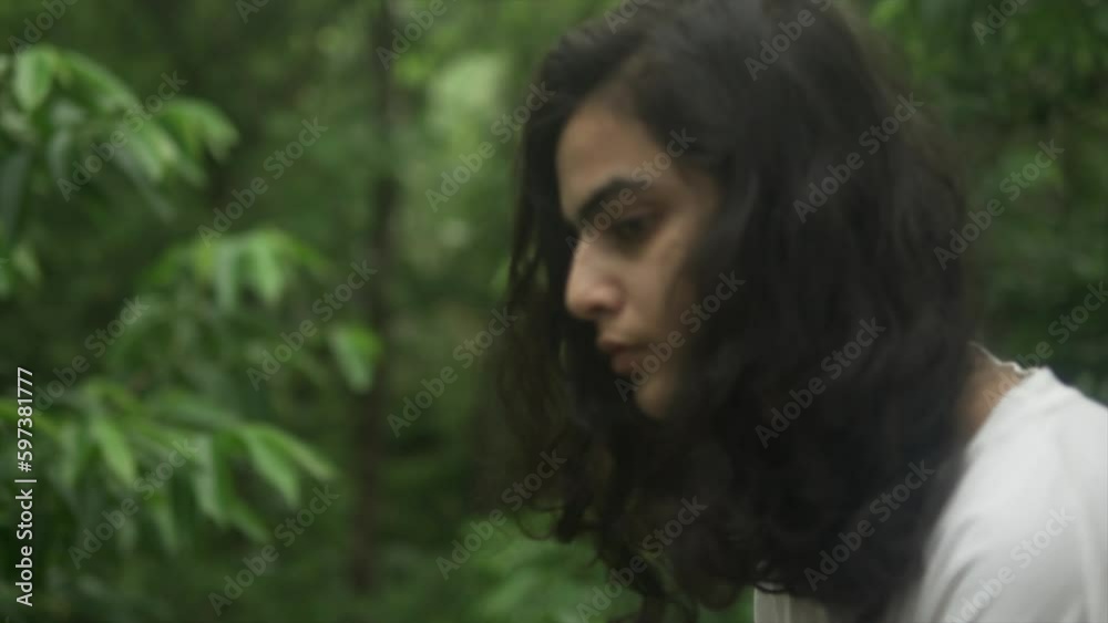 Video Stock Against a blurred background, a young girl's intense and ...