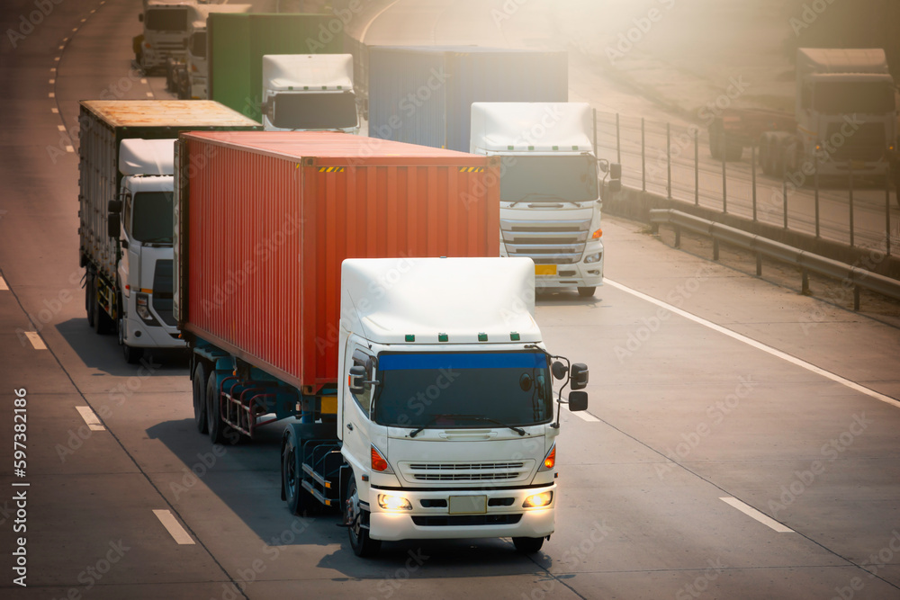 Semi Trailer Truck Driving on Highway Road. Shipping Container Trucks ...
