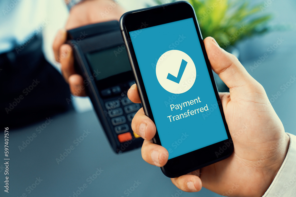 Hand holding smartphone with NFC QR code device, scanning contactless ...