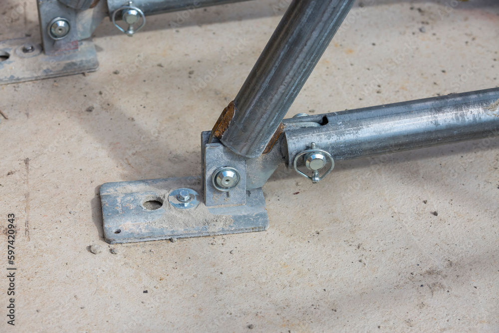 Poster Scaffolding pipe clamp and parts, part of a construction site in ...