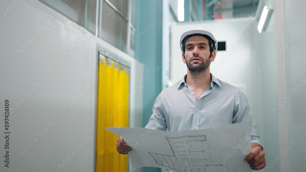 Handsome hispanic latin engineer man wear white safety helmet hold ...