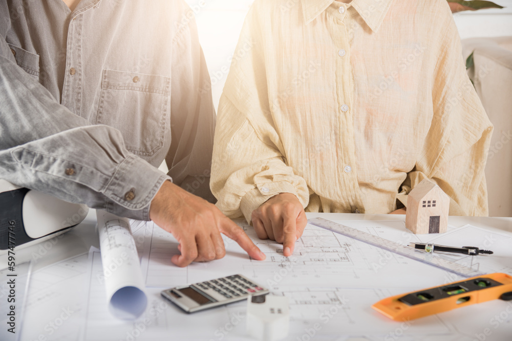 Two engineers pointing at drawings project, Architect team meeting ...