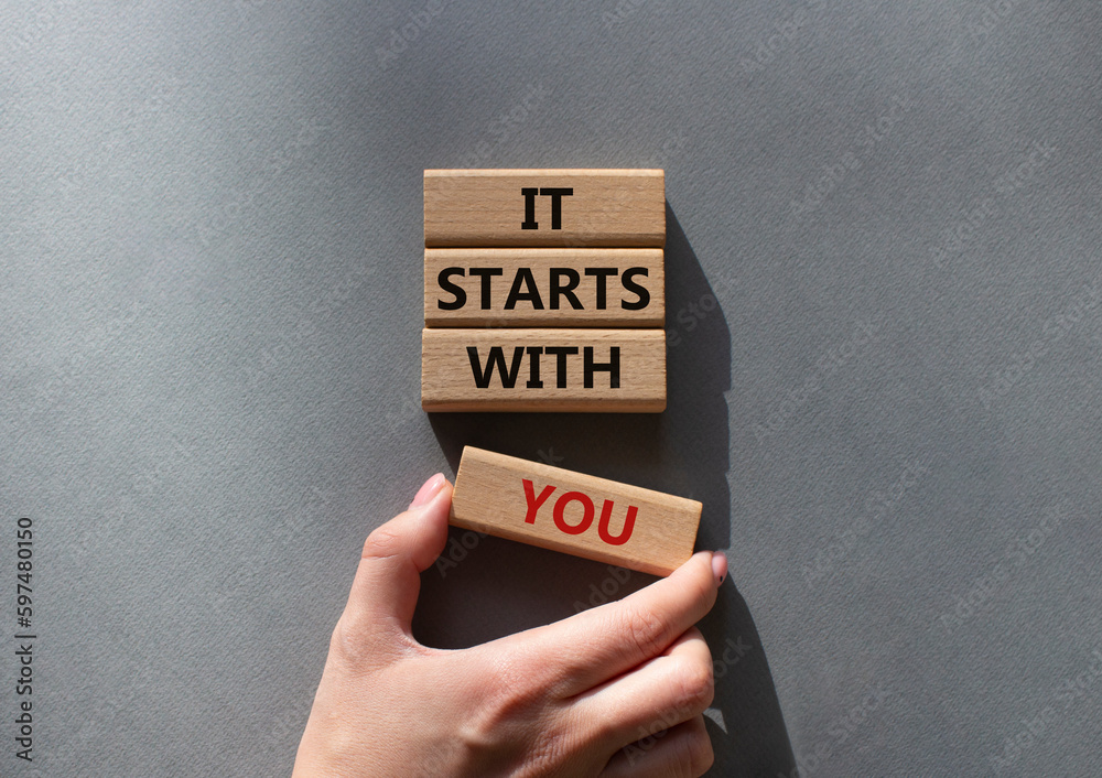 It starts with you symbol. Wooden blocks with words It starts with you ...