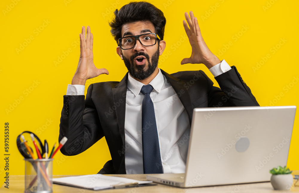 Excited amazed indian businessman touching head, showing explosion ...