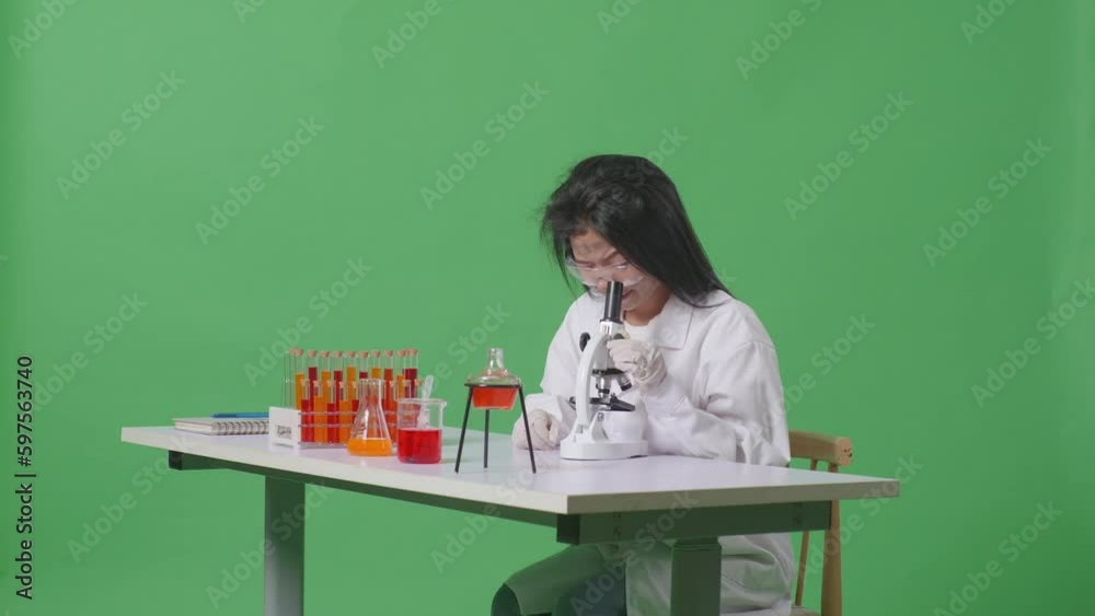 Side View Of Crazy Asian Woman Scientist Looking Through A Microscope ...