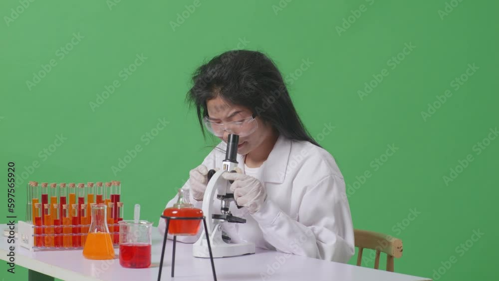 Video Stock Side View Of Crazy Asian Woman Scientist Looks Through A ...