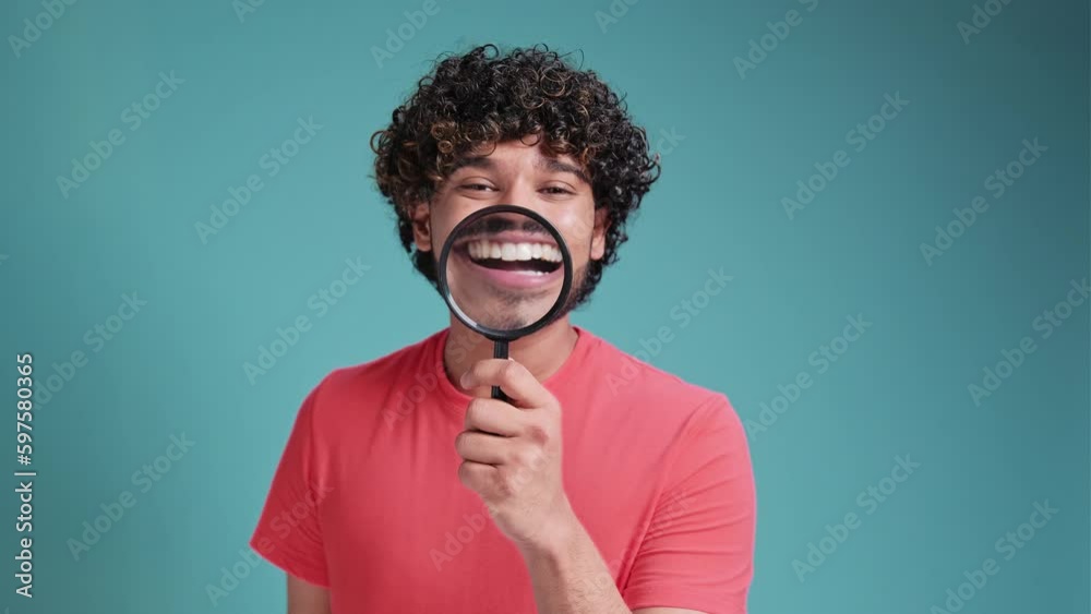 funny latin spanish man shows white teeth and smiles through a ...