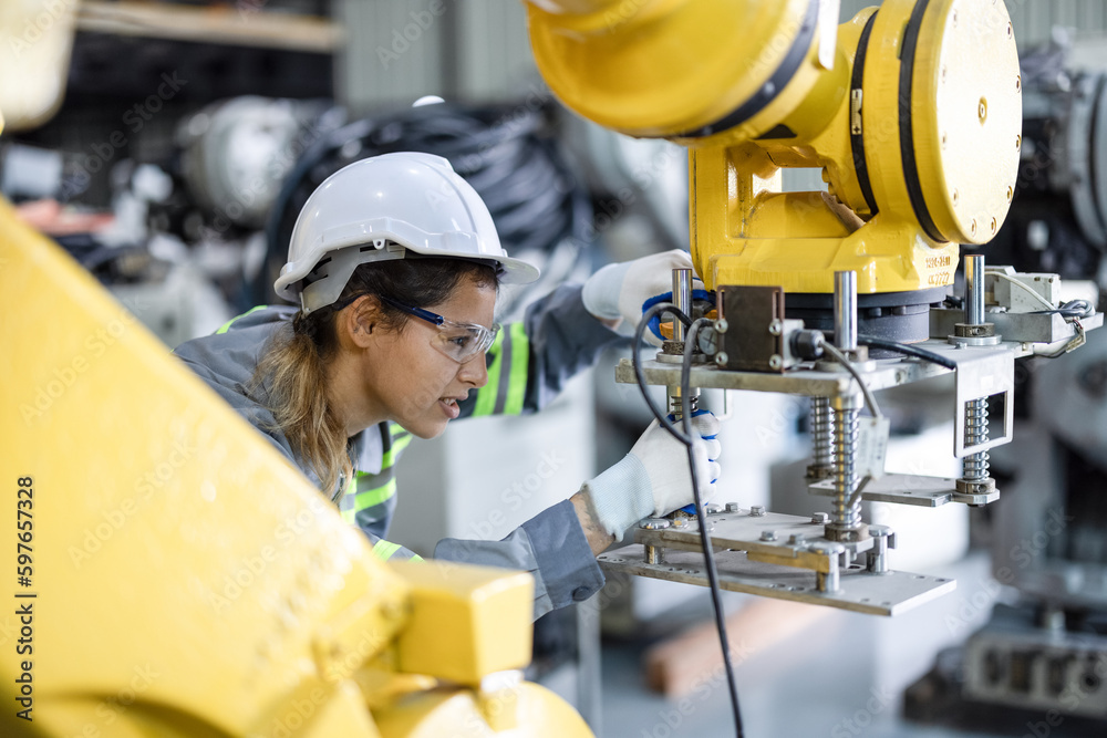Robotic technicians tighten and loosen components with screwdriver and ...