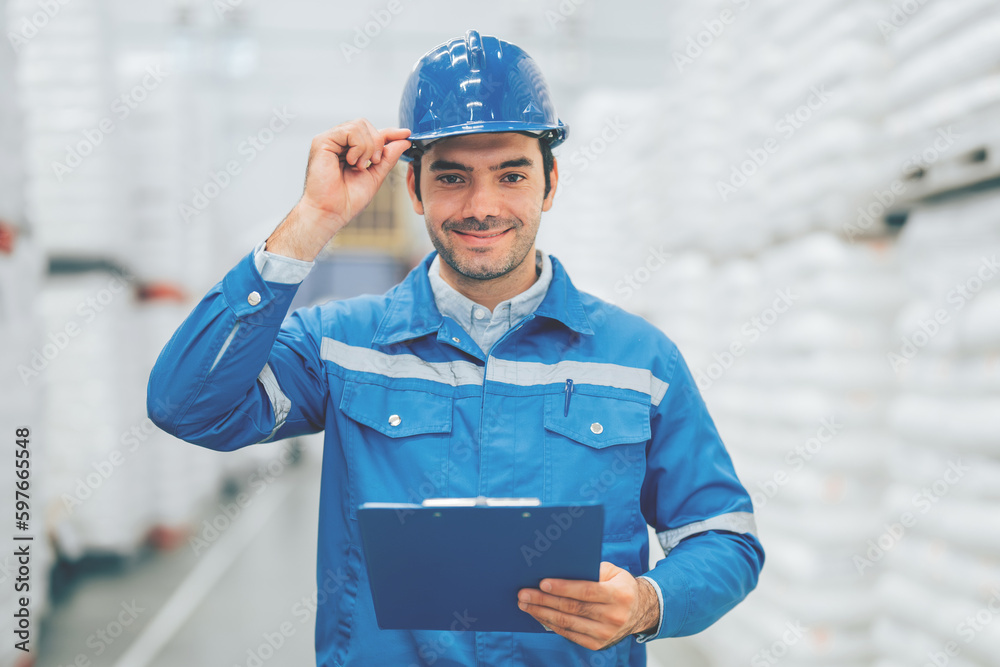 Smart engineer man worker wearing safety helmet doing stocktaking of ...