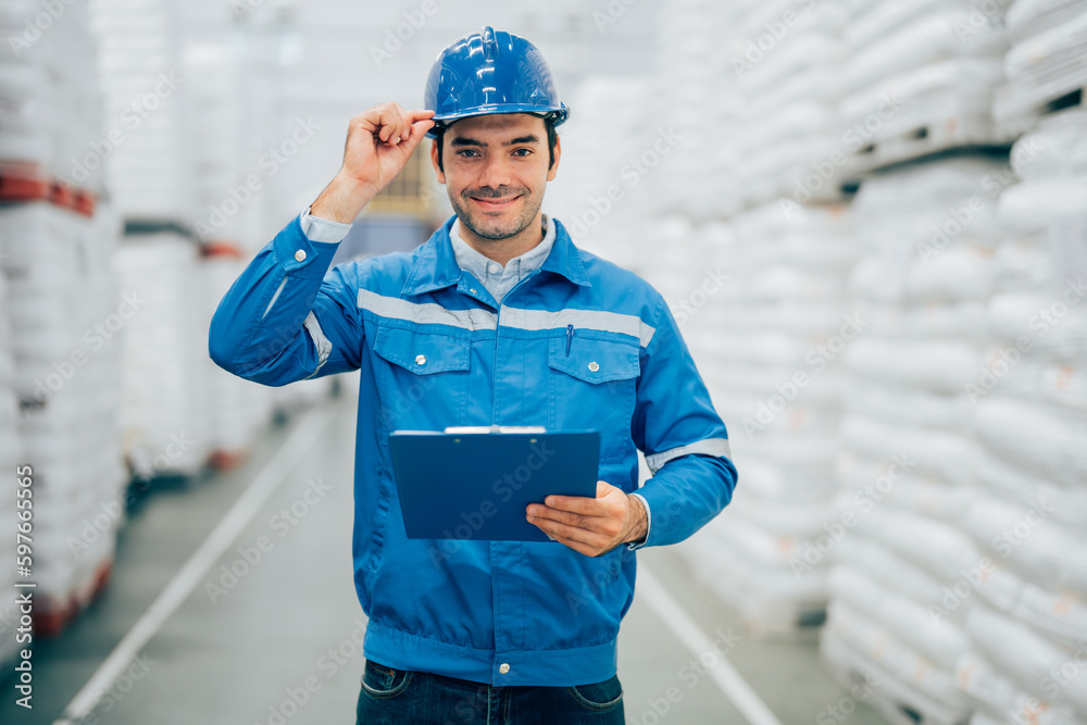 Smart engineer man worker wearing safety helmet doing stocktaking of ...