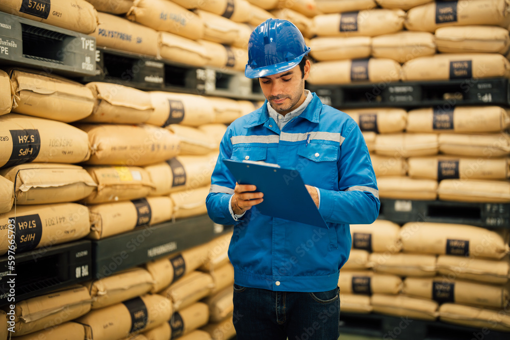 Smart engineer man worker wearing safety helmet doing stocktaking of ...