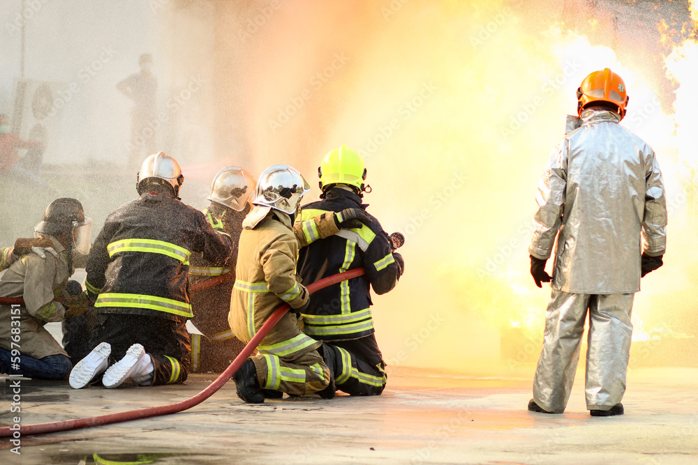 Firefighters using Twirl water fog type fire extinguisher to fighting ...