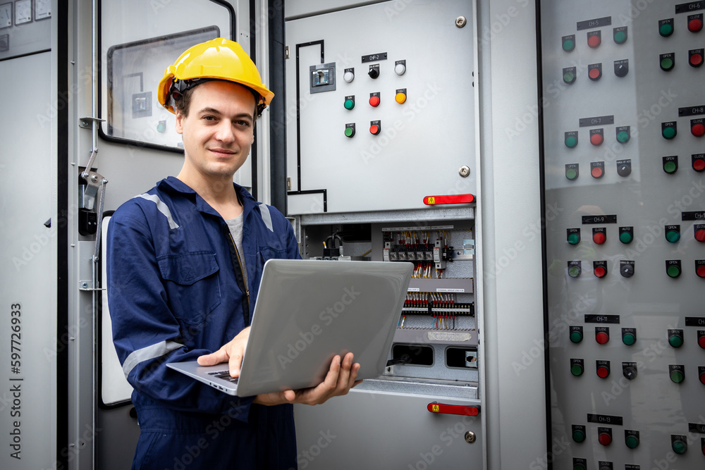 Electrical engineer working in control room. Electrical engineer man ...