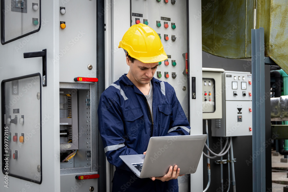 Electrical engineer working in control room. Electrical engineer man ...