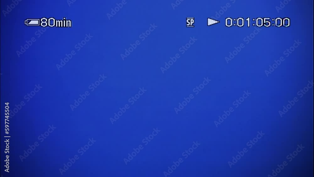 Real analog tape camcorder recording with play icon on blue signal with ...