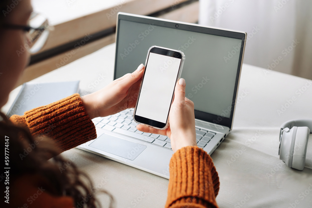 Stylish woman uses smartphone with white blank screen to promote apps ...
