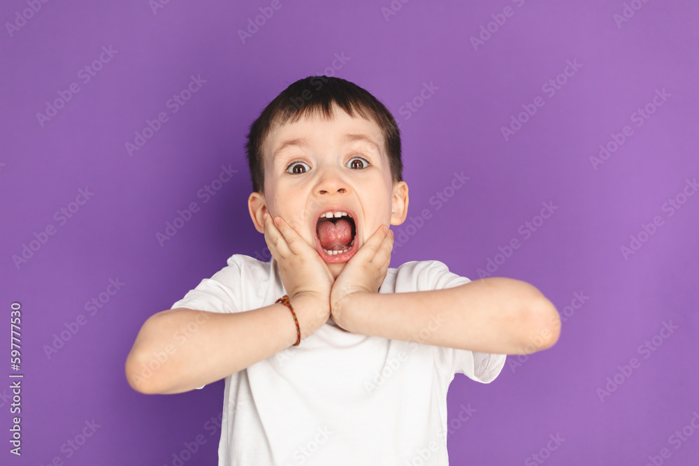 Oh my god, wow! Portrait of funny amazed preschool boy looking at ...