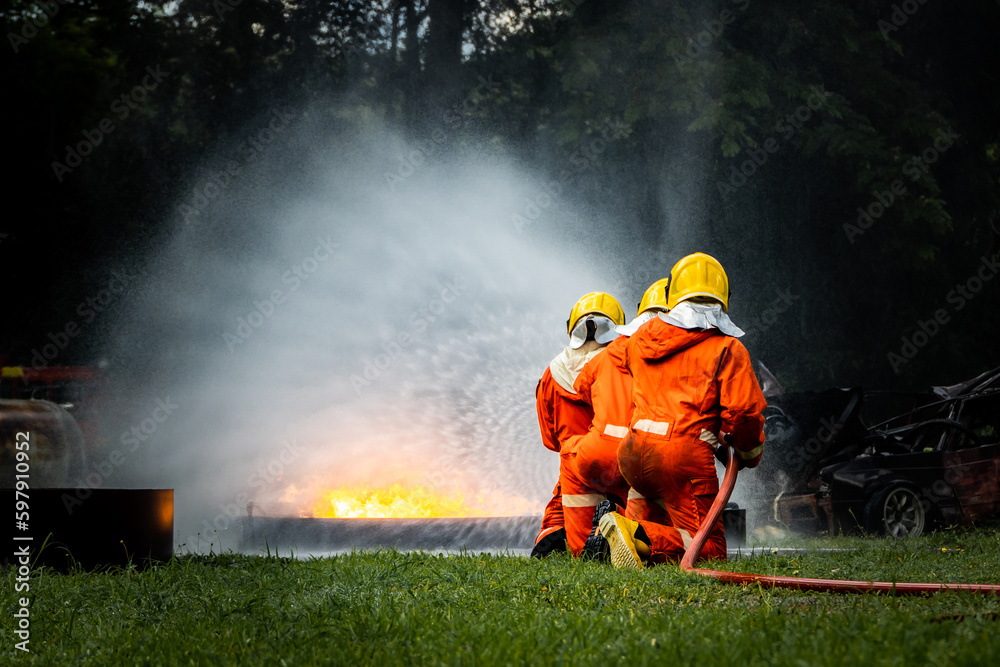 Firefighter Concept. Fireman using water and extinguisher to fighting ...