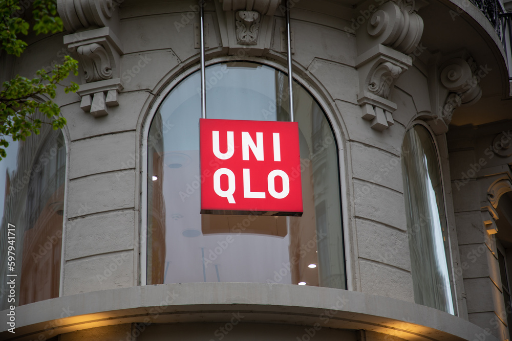 Uniqlo logo brand and text red sign facade chain in bordeaux french ...