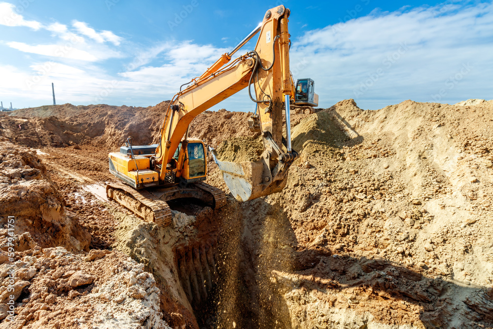 Two Excavator are digging soil in the construction site on sky ...