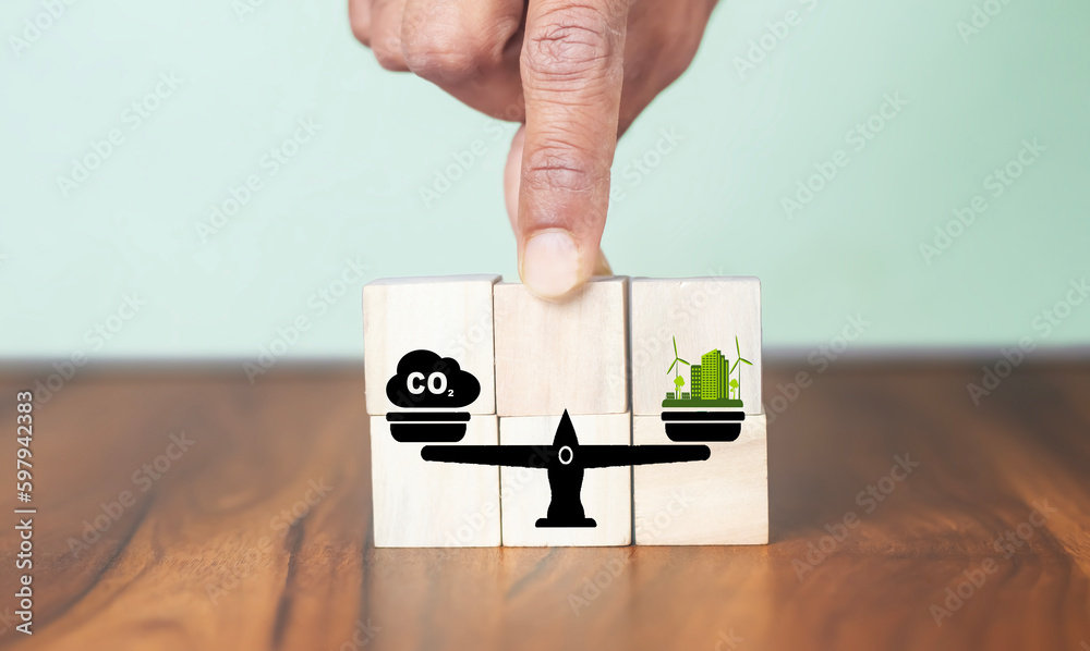 Carbon neutral balancing CO2 emission offset concept. Planting of trees ...