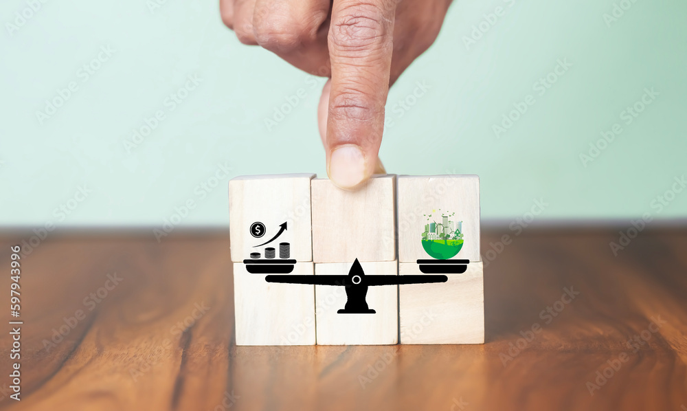 Sustainable development concept. Weight scale with green planet and ...