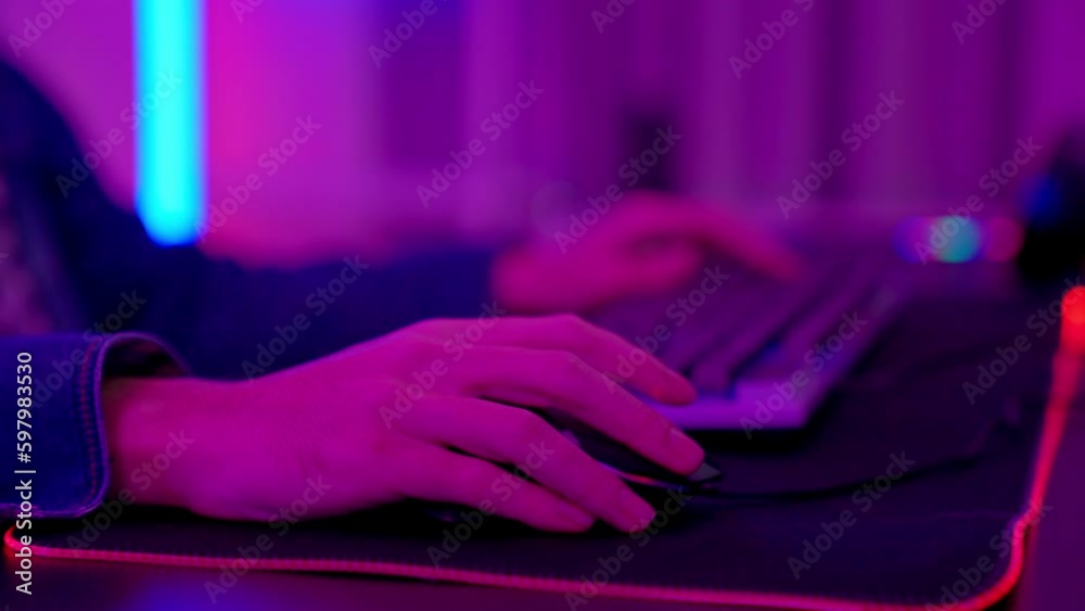 RGB neon light. finger tapping on neon backlit gaming mouse, cybersport ...