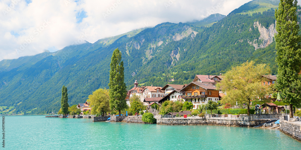 pictorial lakeside Brienzersee, turquoise water, view to tourist resort ...