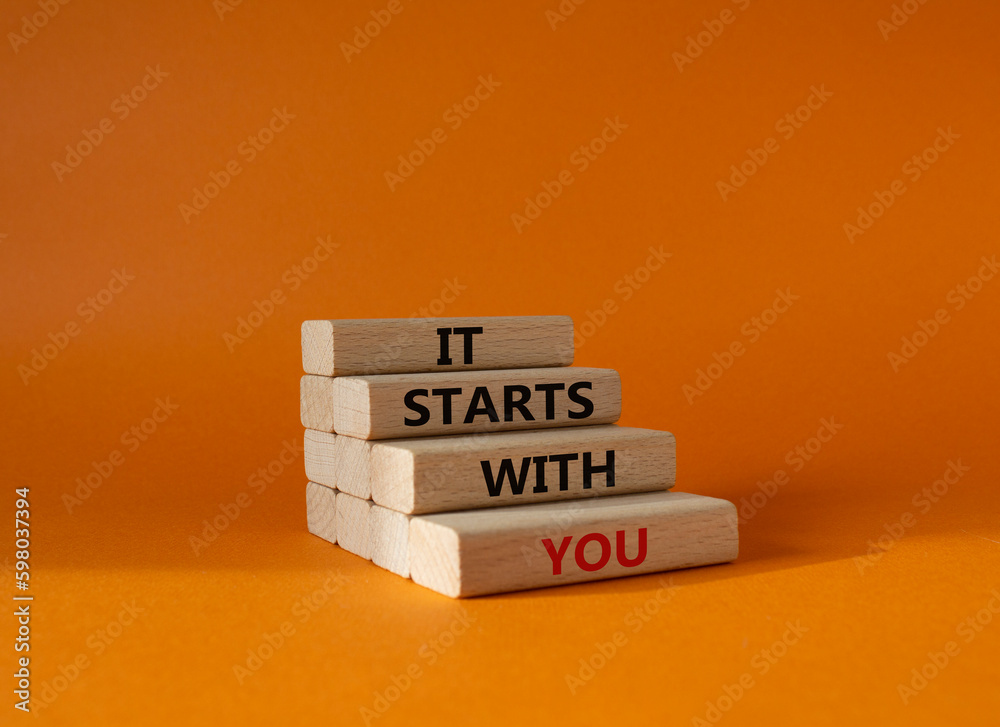 It starts with you symbol. Wooden blocks with words It starts with you ...