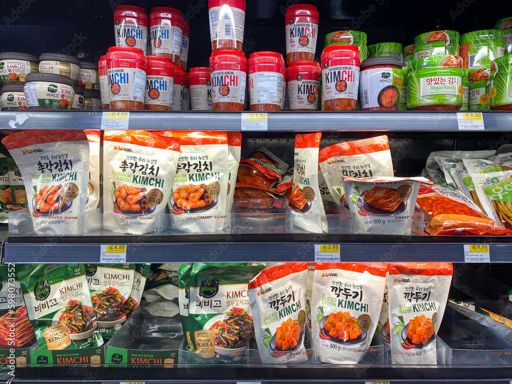 Different brands of kimchi on shelves on an Asian supermarket. Stock ...