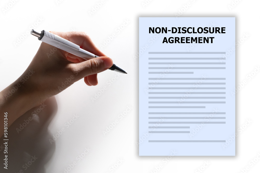 NDA contract. Hand signs document. Non-disclosure agreement. Agreement ...