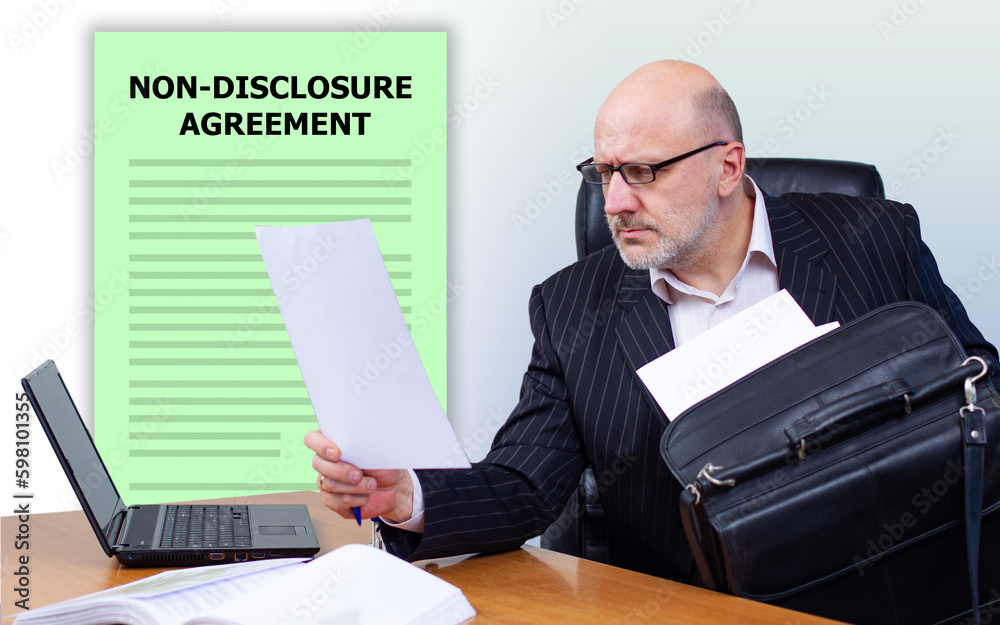 Non-disclosure agreement. Man in office. Businessman signs contract ...
