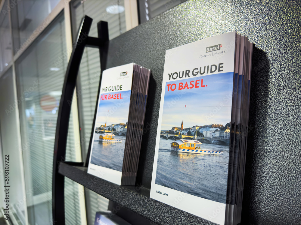 Basel, Switzerland - Sep 22, 2022: A modern airport information stand featuring brochures, text ...