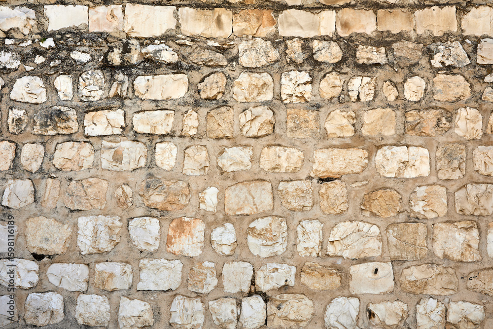the texture of the old stone Jerusalem wall in beige color, natural ...