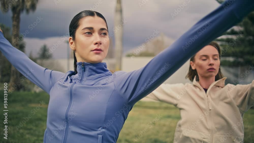 Calm besties practicing yoga gloomy nature. Yogini making asana pose ...