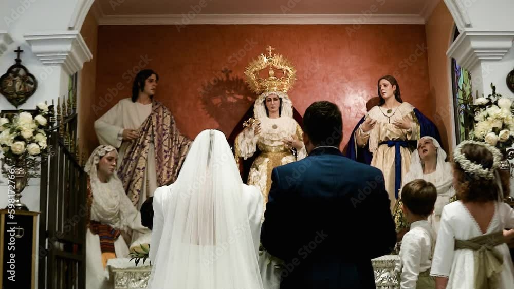 Bride and groom at their Catholic wedding vowing eternal love to each ...