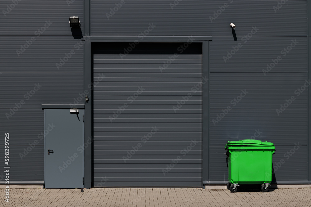 Industrial building with rolling gate for loading dock and large waste ...