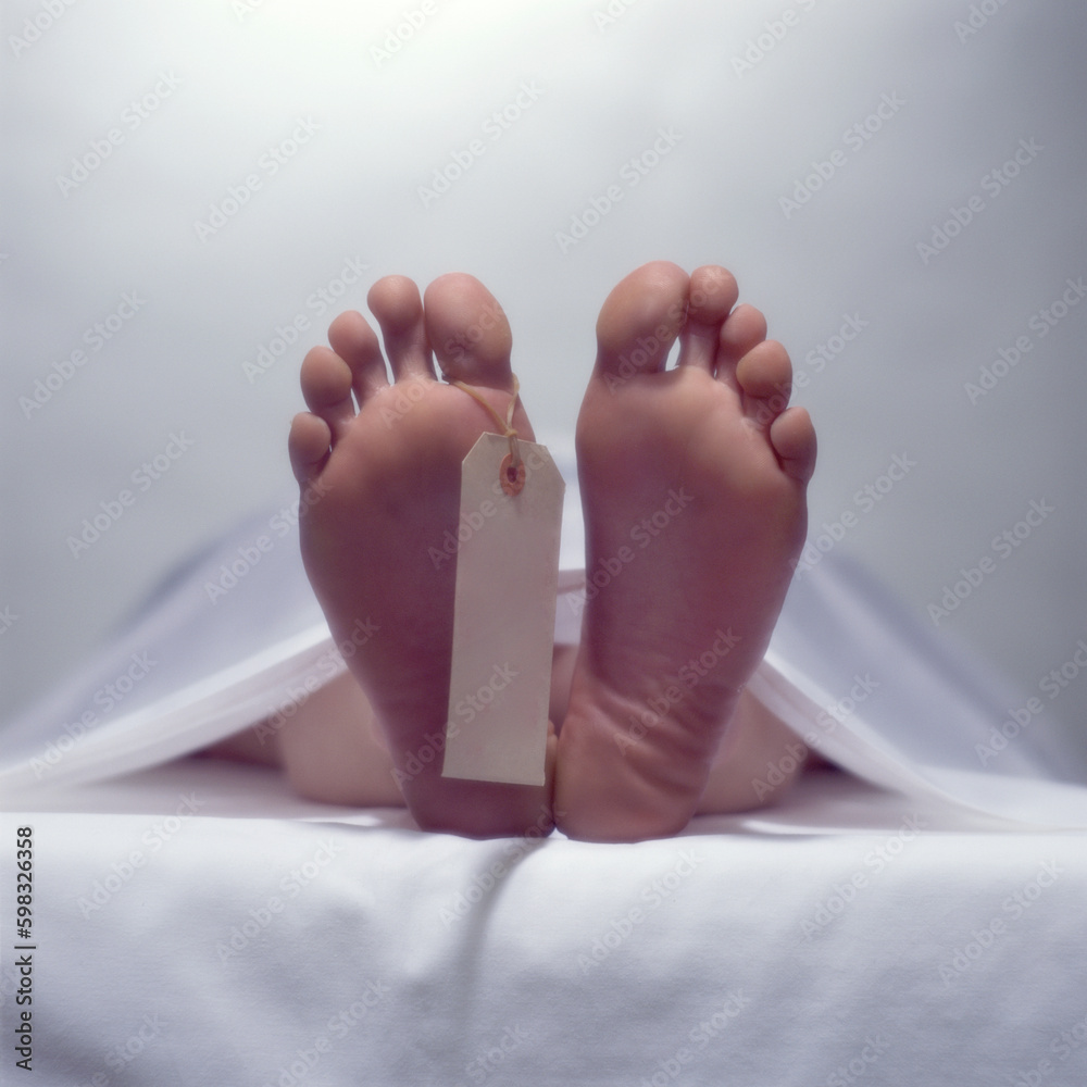 Feet of a dead corpse with an identification label in the morgue Stock ...