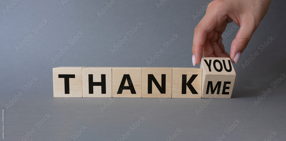 Thank You or Me symbol. Businessman Hand turns cubes and changes words ...