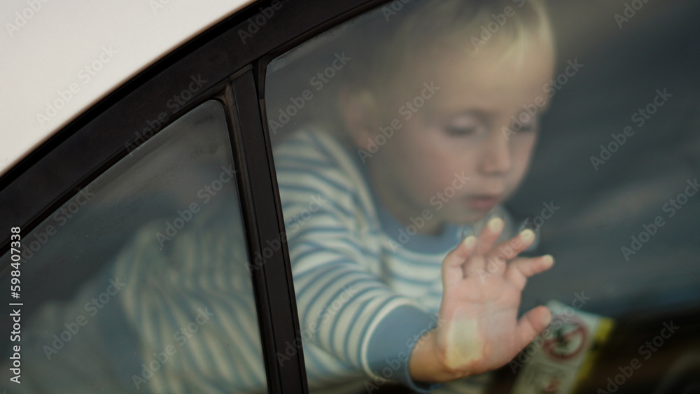 Child trapped in a car on a hot day. Conceptual image of overheating ...